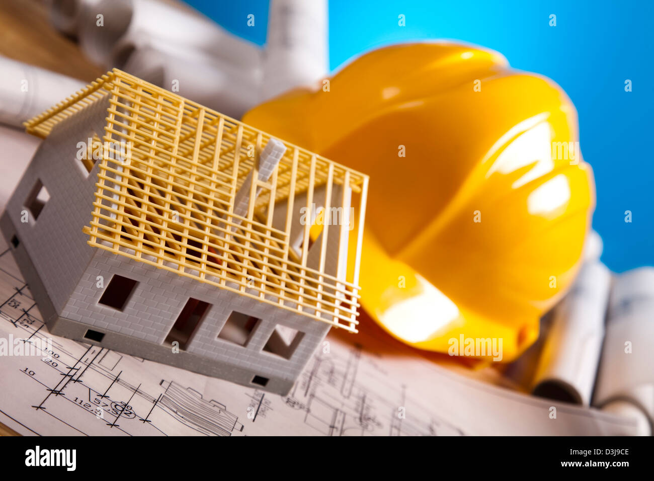 Architectural plans of house and hard hat Stock Photo - Alamy