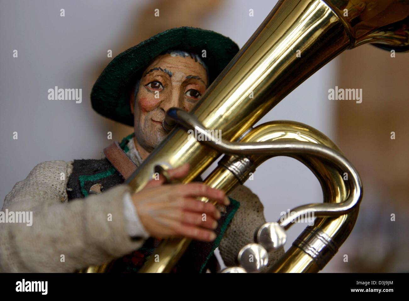 (dpa) - A figurine carved out of wood playing a tuba in a workshop in ...