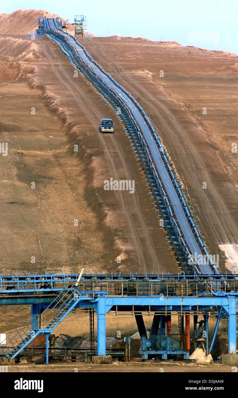 (dpa) - A car drives across the mining dump of the potash plant in ...