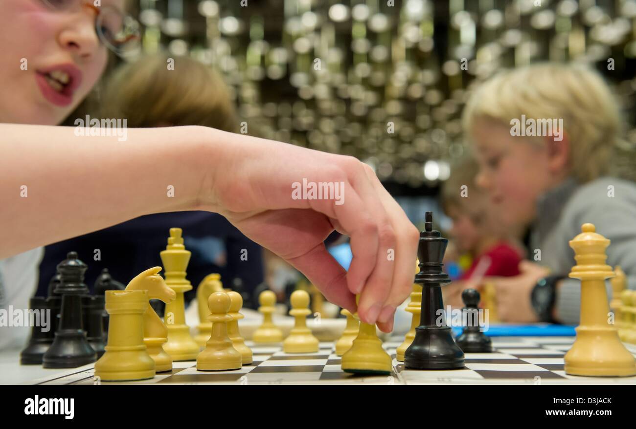 Pupils play chess during a School Chess Tournament at Congress Center ...