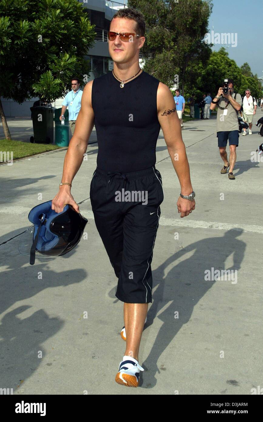 (dpa) The German F1 world champion Michael Schumacher (Ferrari) smiles ...