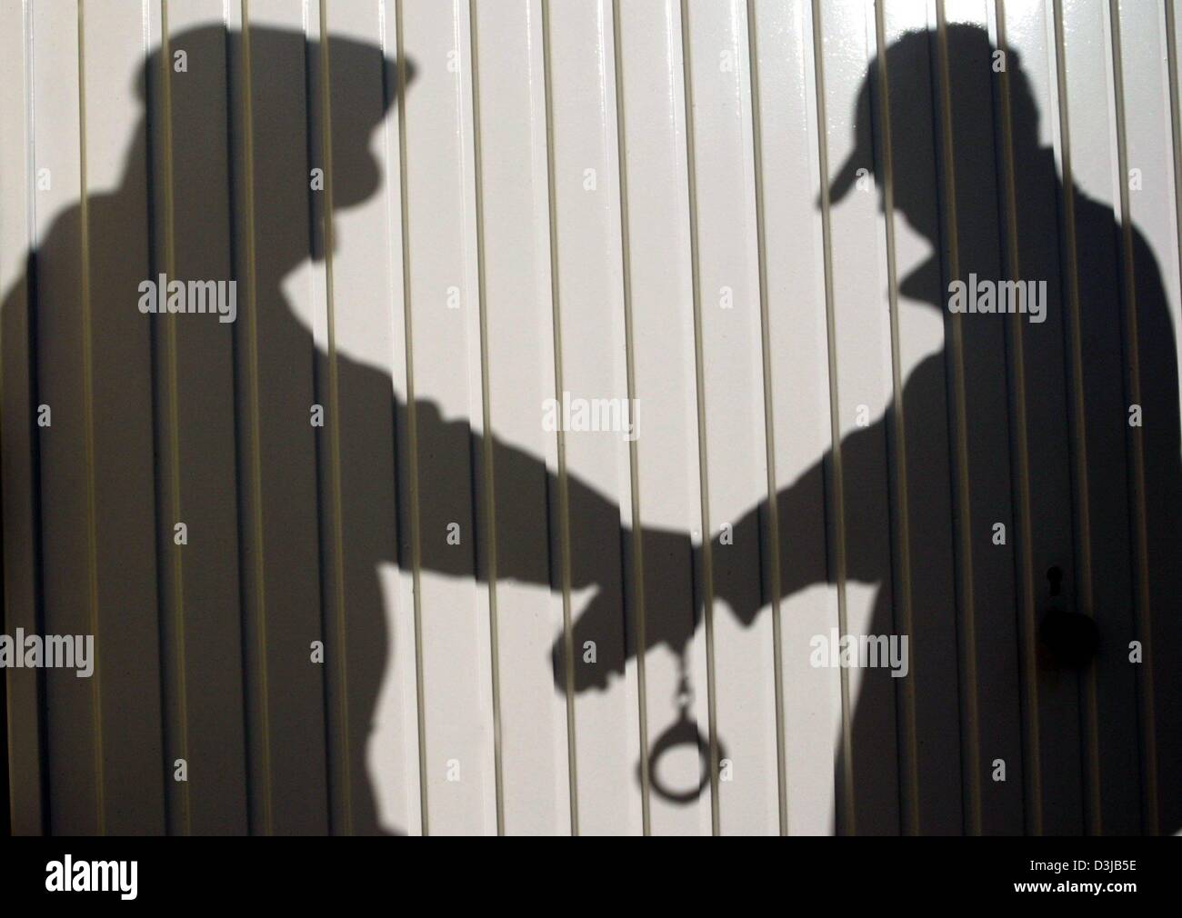 Crime law justice clj police criminal handcuffs hands policeman shadows ...