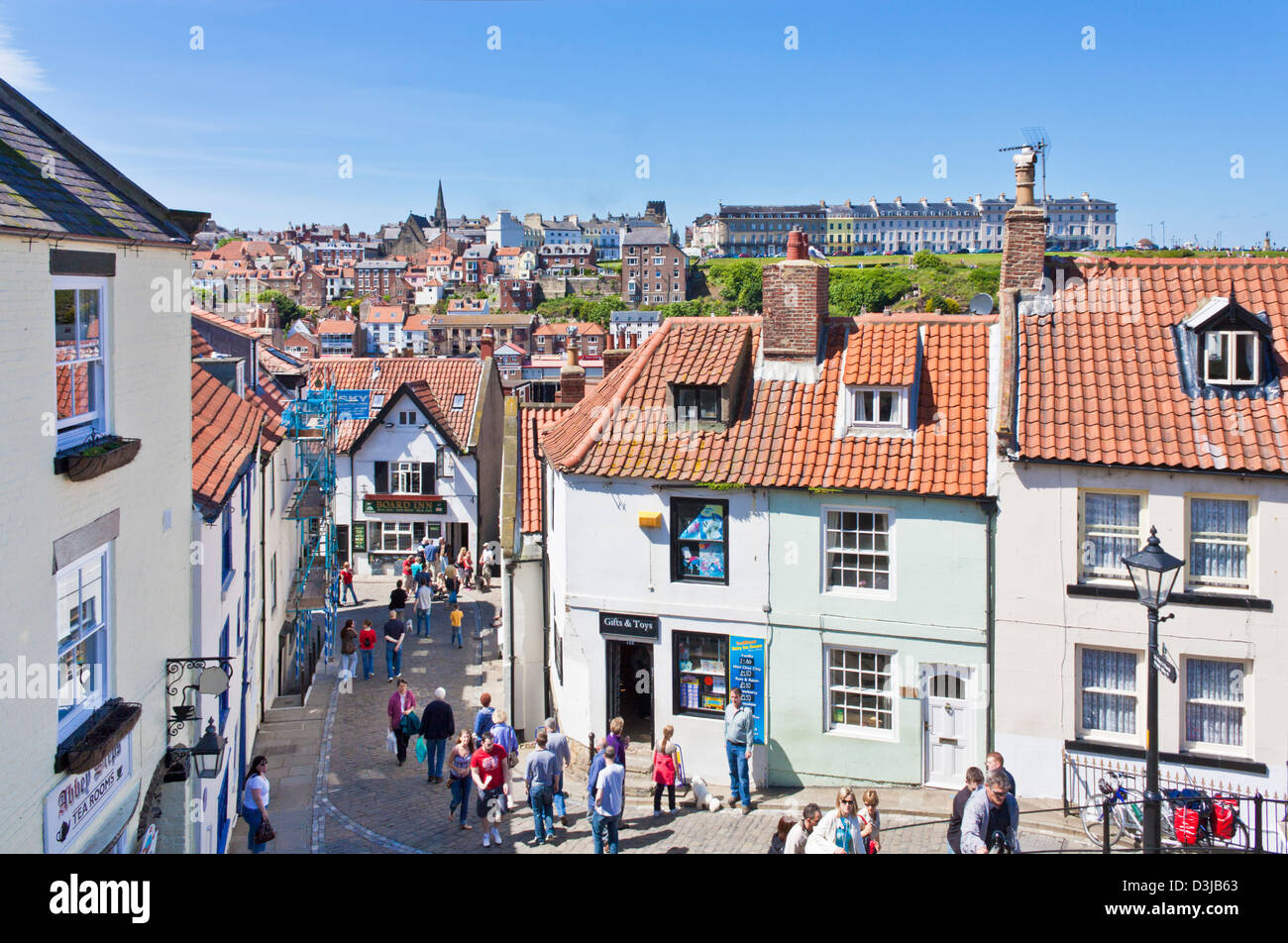 People walking through Whitby old town North Yorkshire England UK GB EU ...