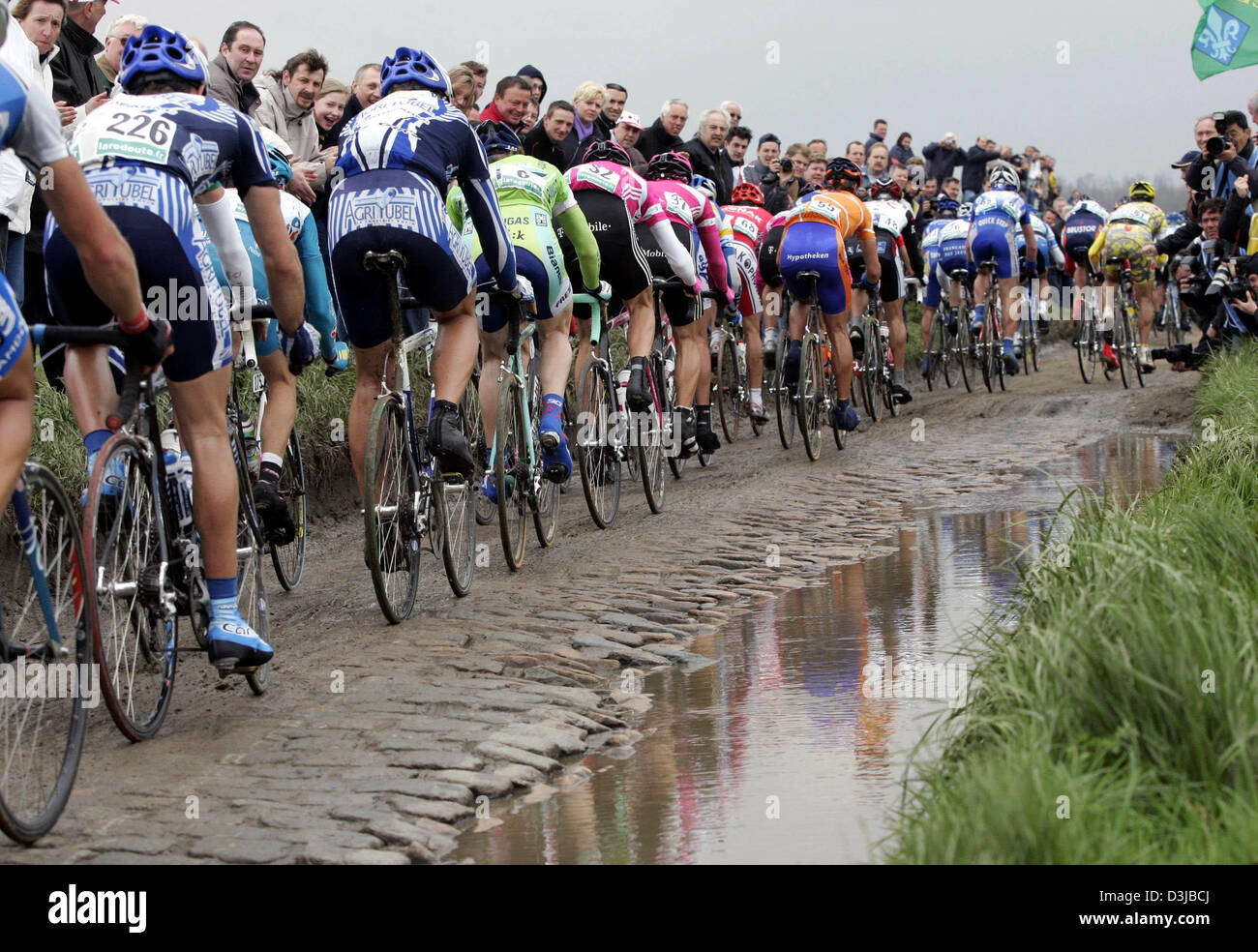 (dpa) - Cyclists pictured during the cobblestone classic Paris-Roubaix ...
