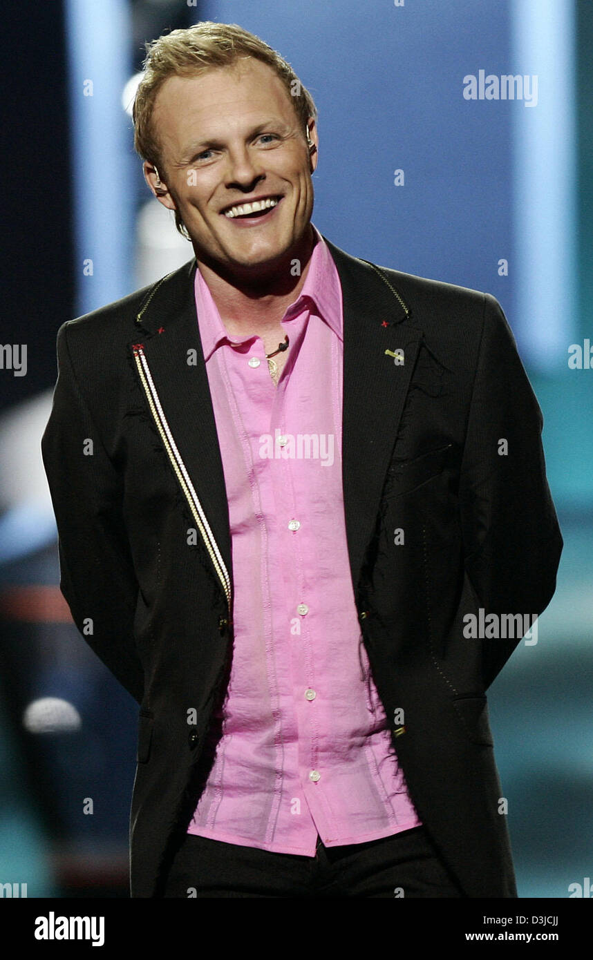 (dpa) - Danish singer Jakob Sveistrup smiles as performs his song ...