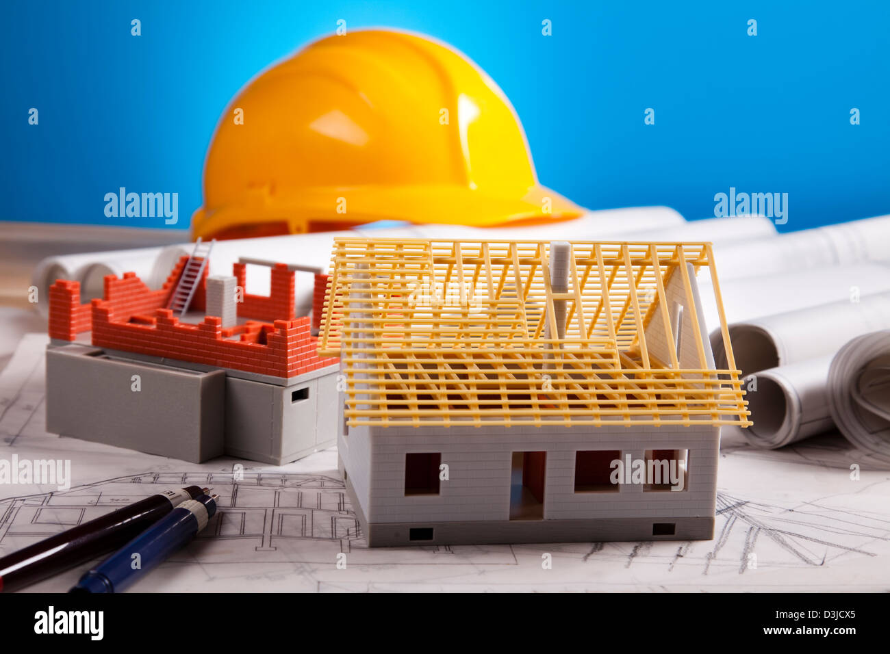 Architecture plans,house project and yellow hard hat Stock Photo - Alamy