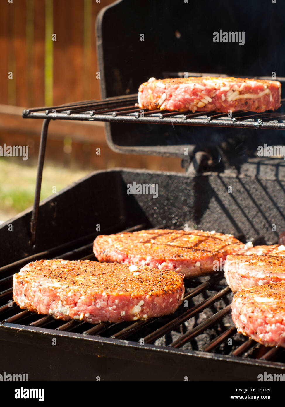 Gourmet hamburger parries on the grill Stock Photo - Alamy