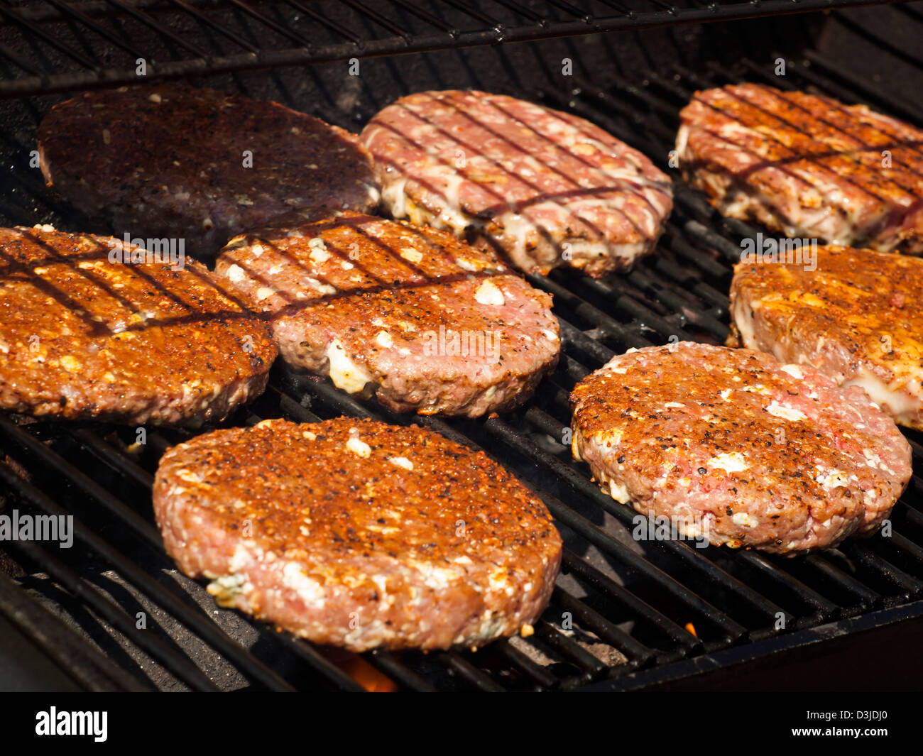 Gourmet hamburger parries on the grill Stock Photo - Alamy