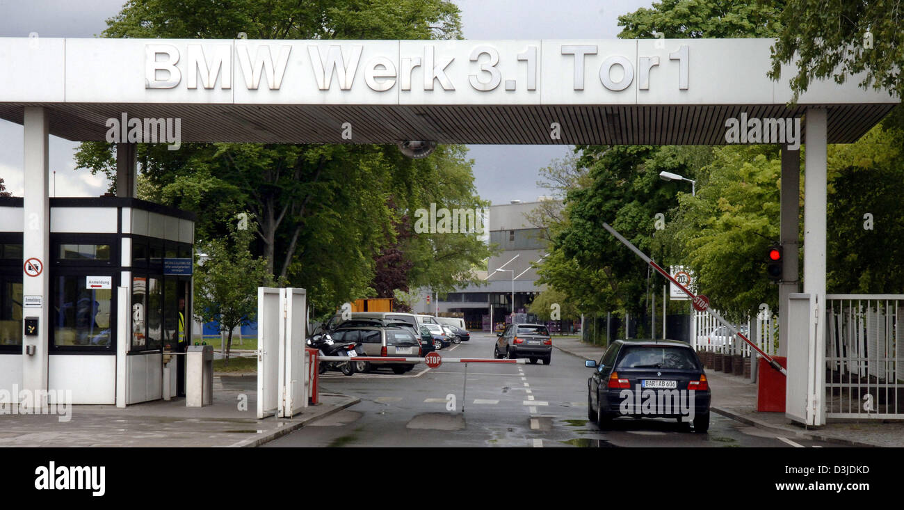 (dpa) - A BMW arrives at the factory gate of the BMW assembly plant for ...