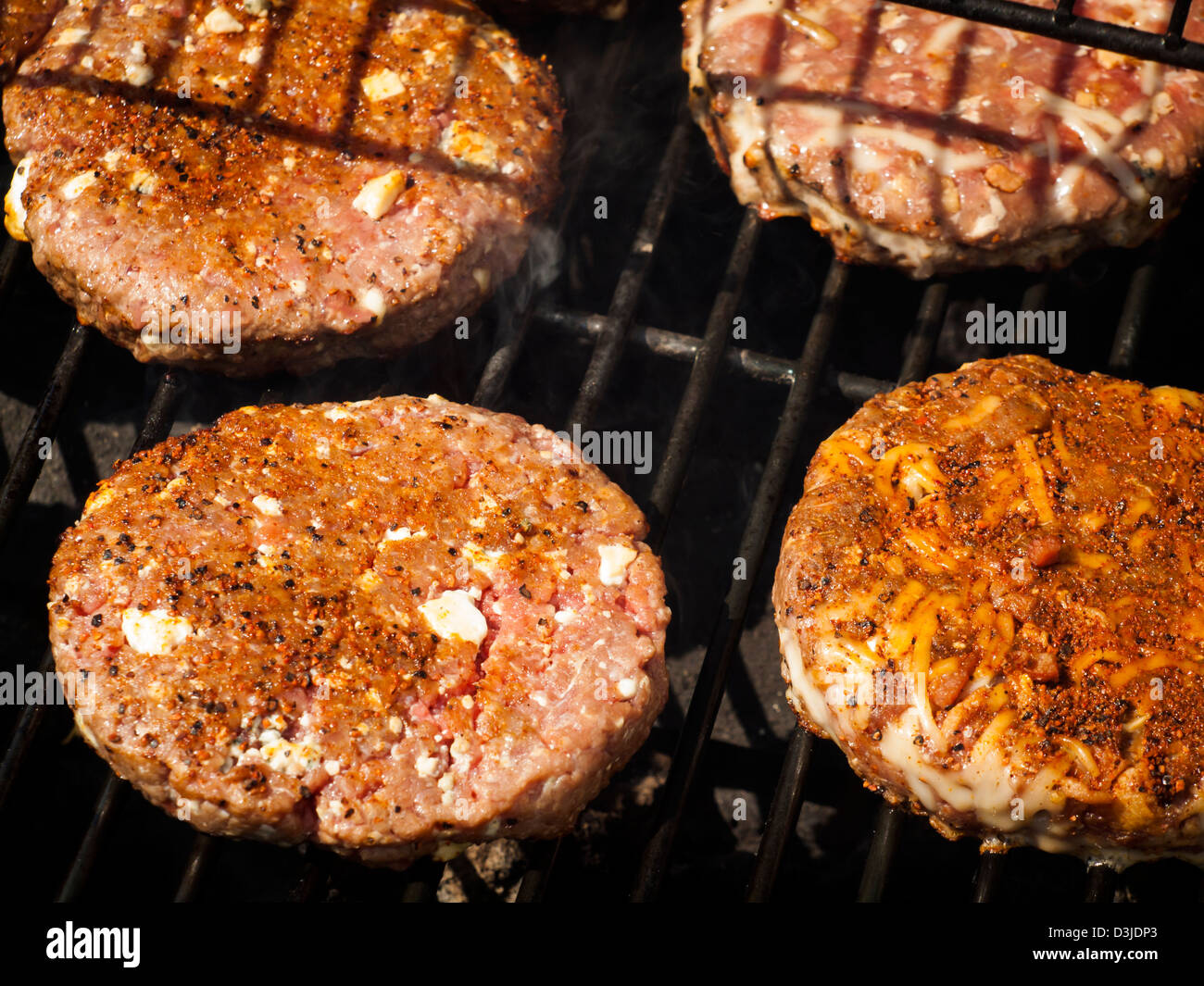 Gourmet hamburger parries on the grill Stock Photo - Alamy