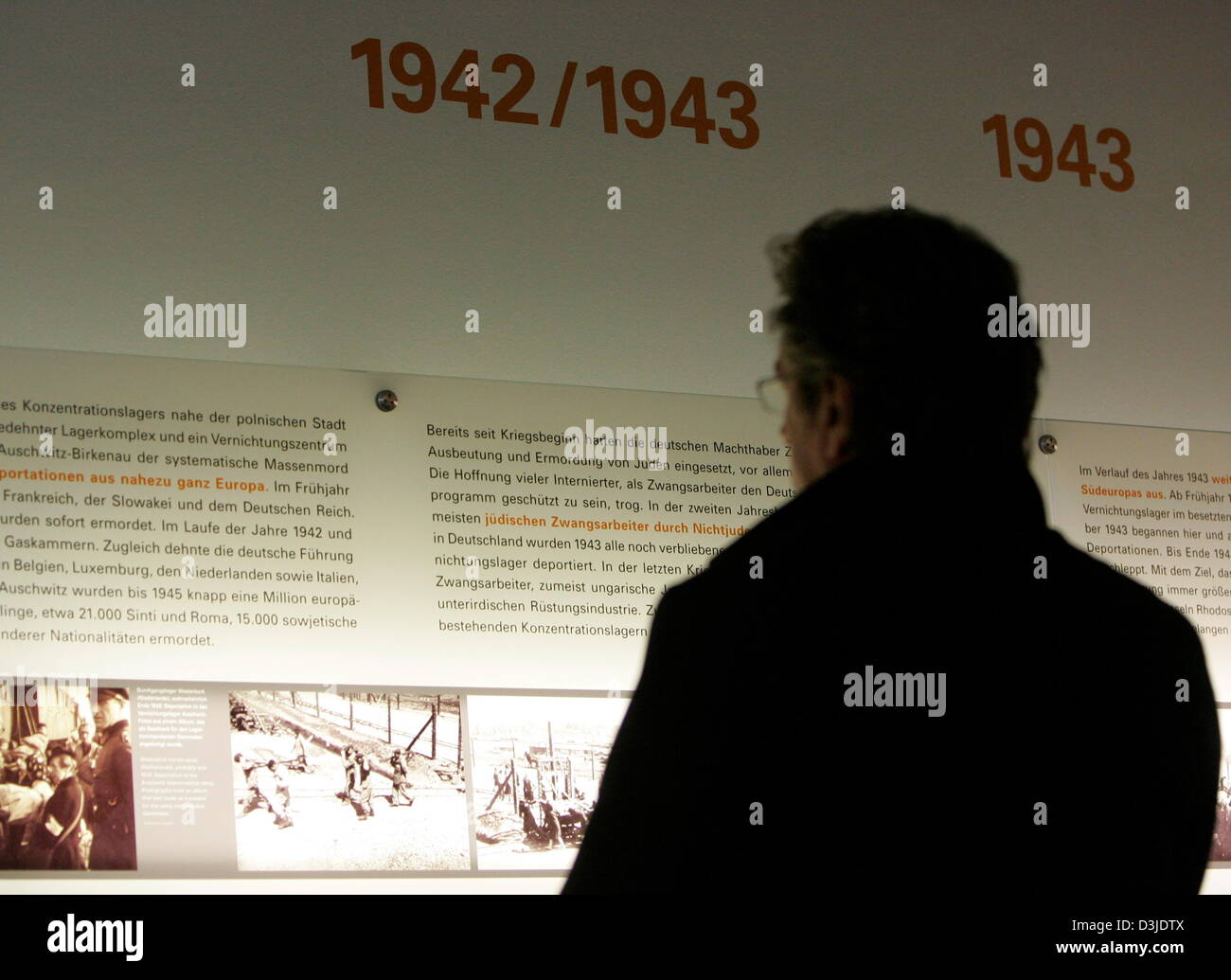(dpa) - A journalist looks at a presentation board in the accessible ...