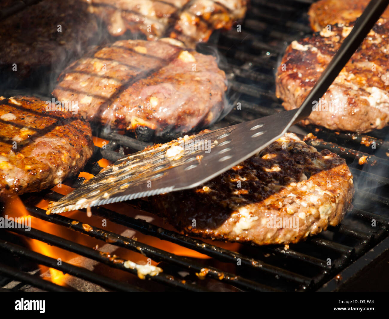 Gourmet hamburger parries on the grill Stock Photo - Alamy