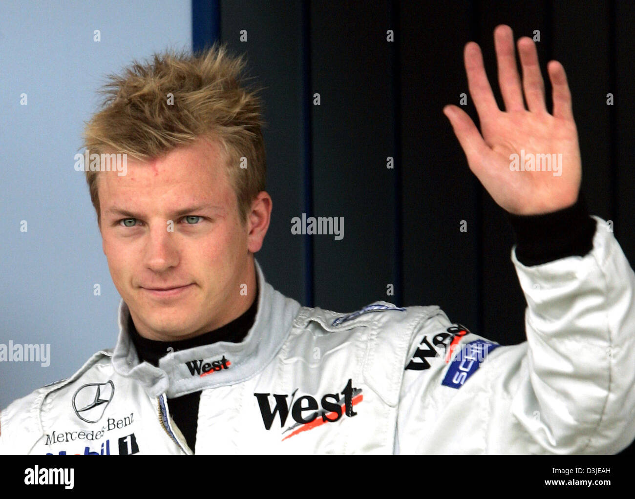 (dpa) - Finish Formula One driver Kimi Raeikkoenen greets the fans ...