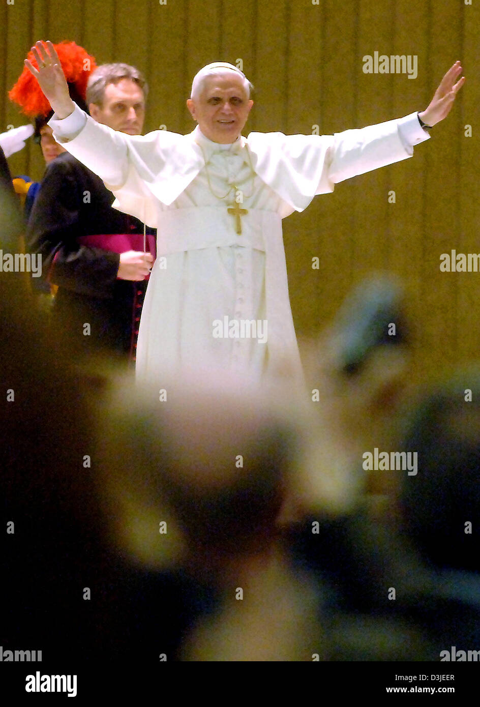 (dpa) - Pope Benedict XVI (C) gestures and smiles as he greets several ...