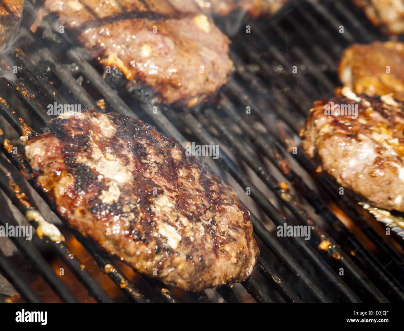 Gourmet hamburger parries on the grill Stock Photo - Alamy