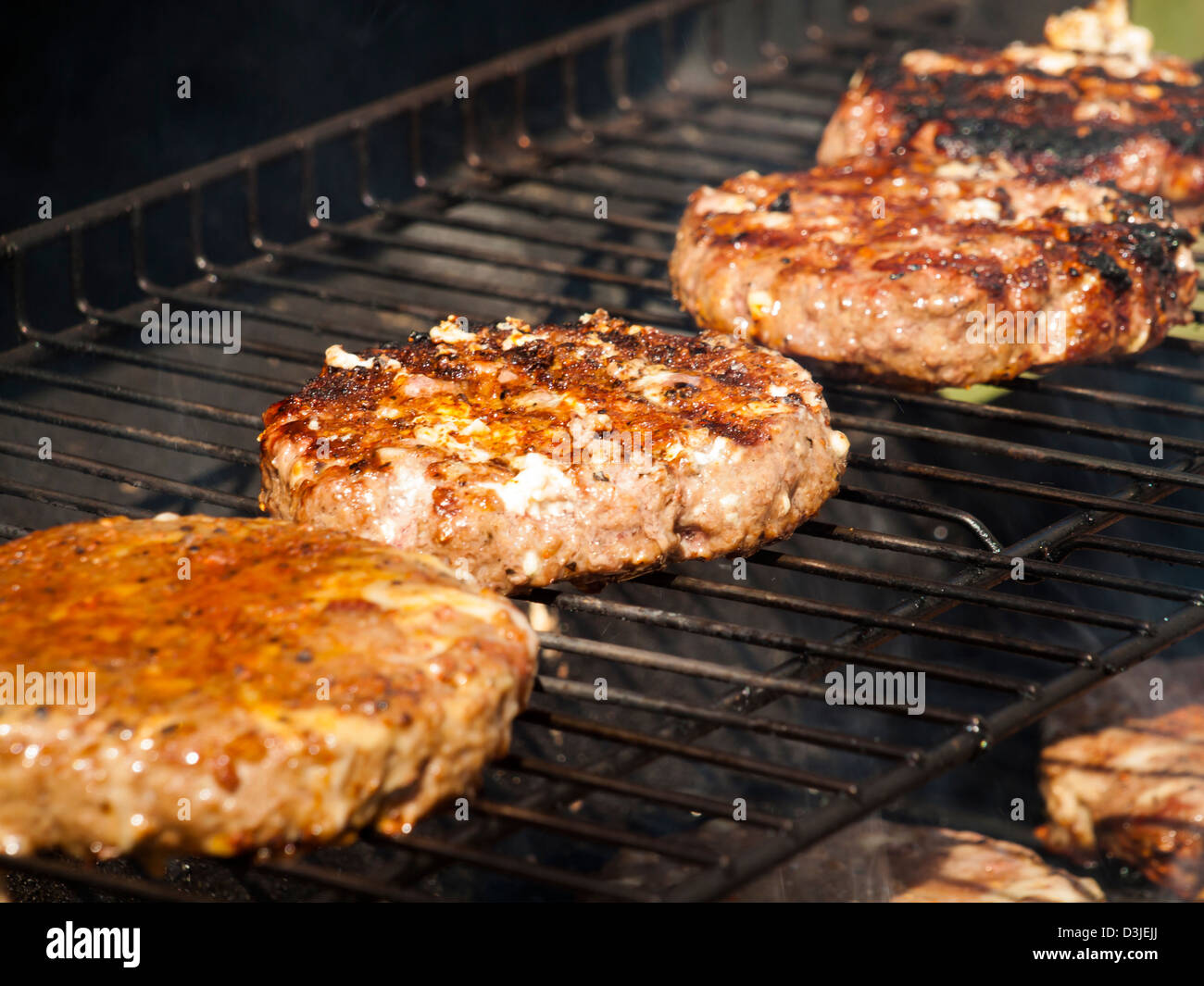 Gourmet hamburger parries on the grill Stock Photo - Alamy