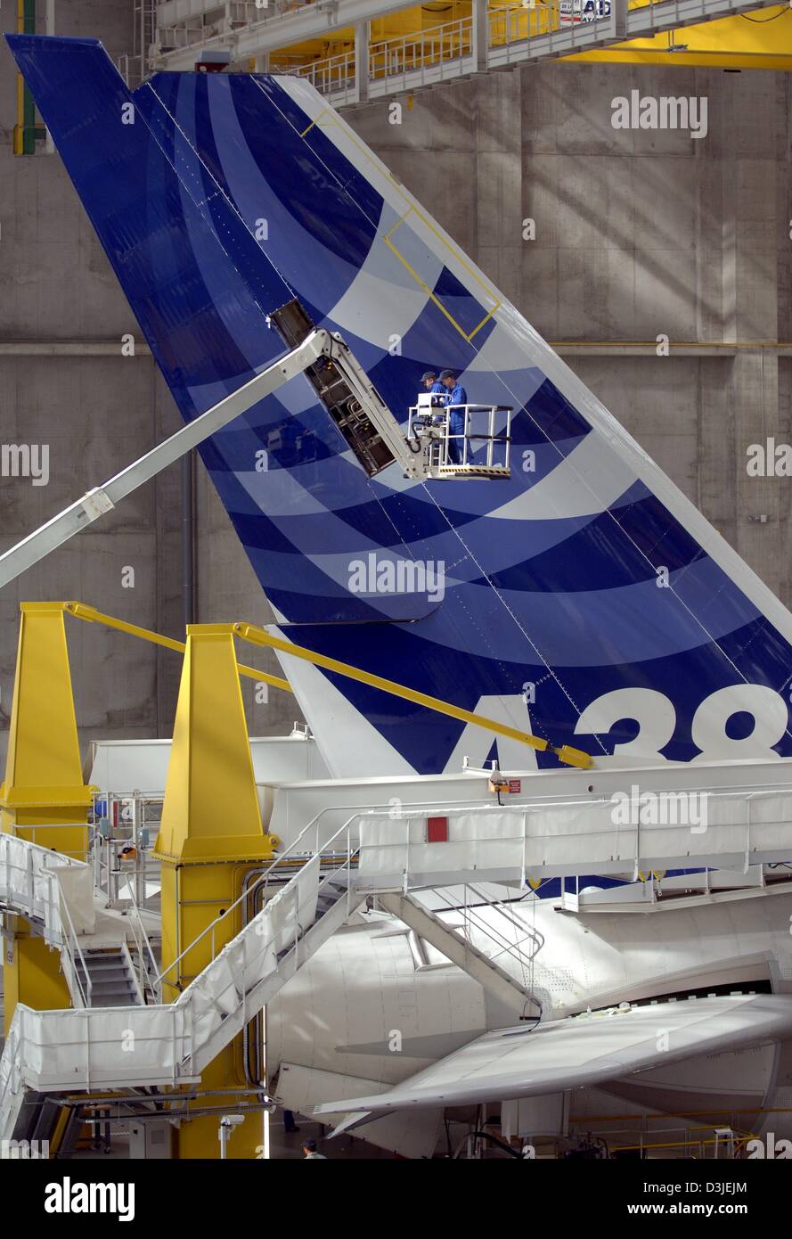 (dpa) - Employees assemble a tail unit of the new Airbus A380 at the ...