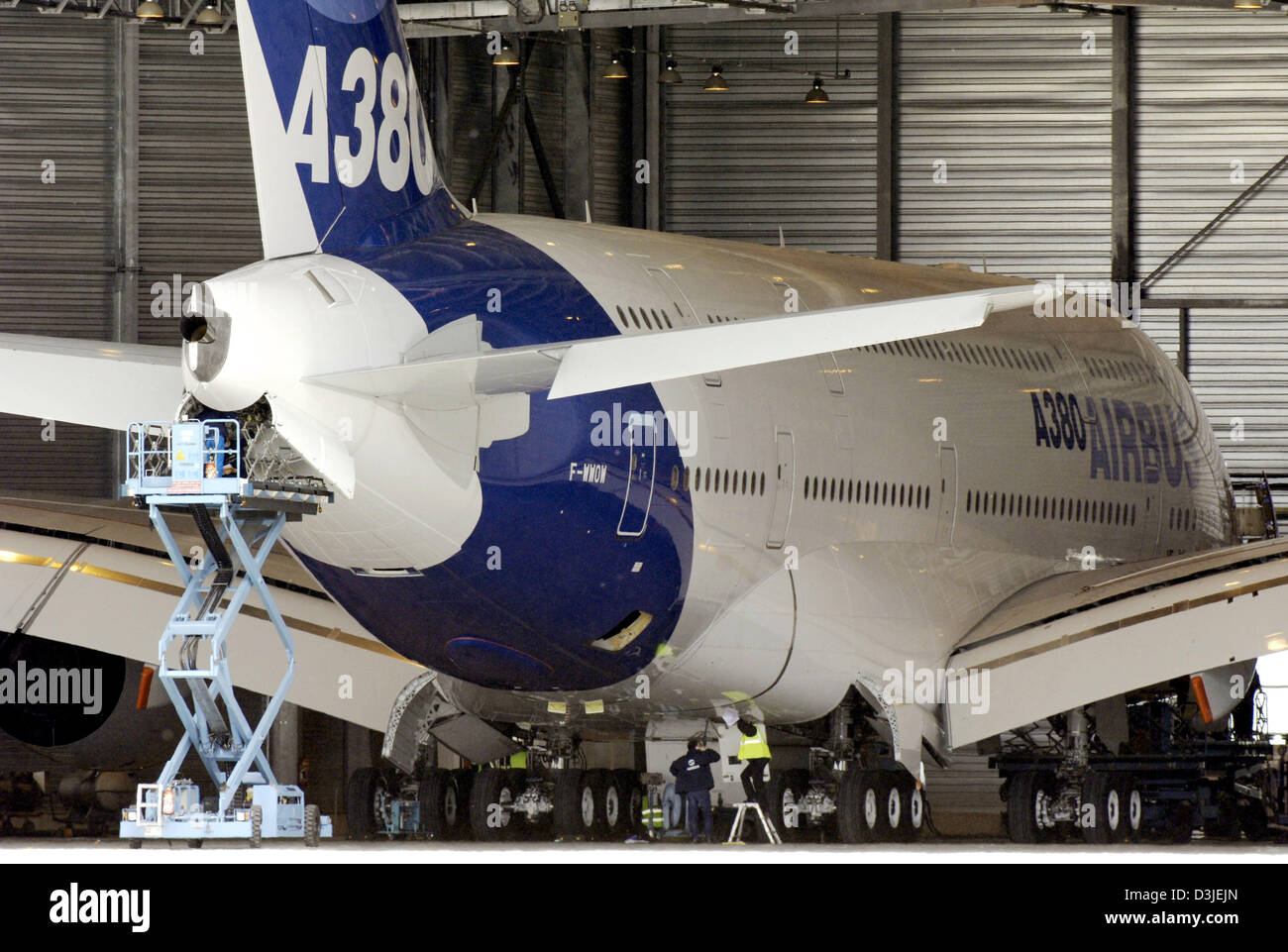 (dpa) - Technicians inspect the prototype of the new Airbus A380 in a ...
