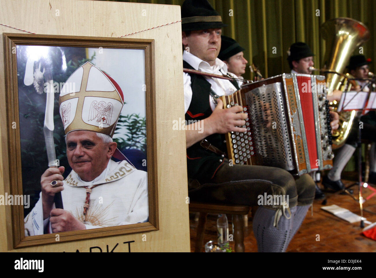 (dpa) - A traditional Bavarian brass band performs on stage next to a ...