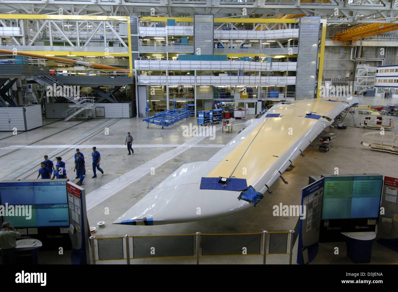 (dpa) - Employees assemble a wing of the new Airbus A380 at the Airbus ...