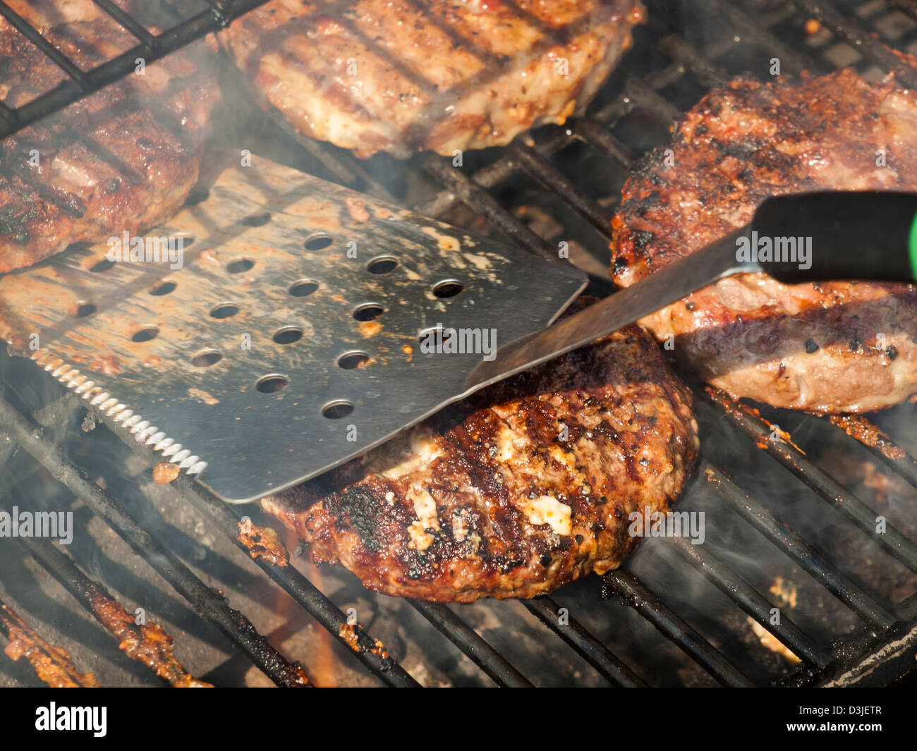 Gourmet hamburger parries on the grill Stock Photo - Alamy