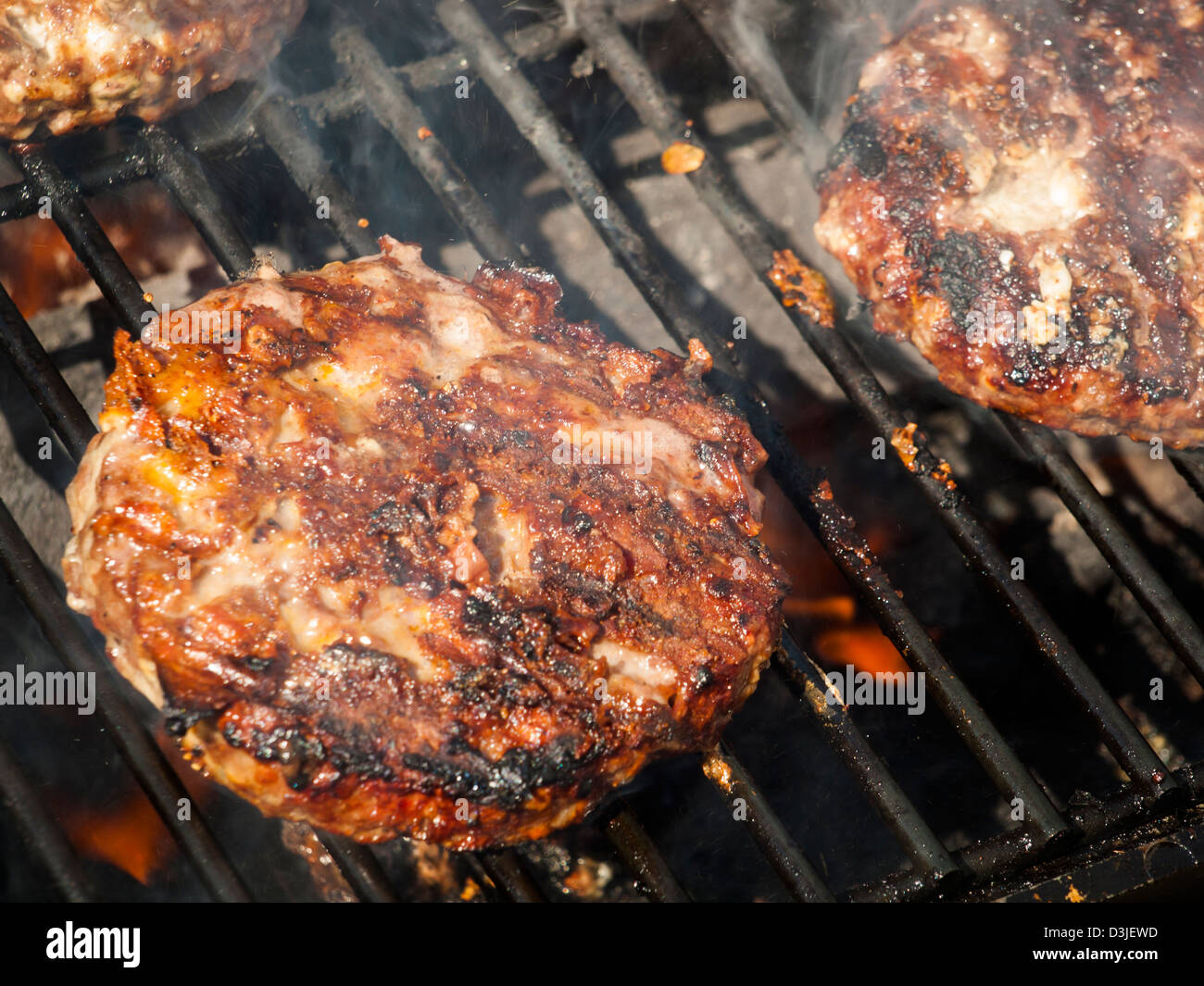 Gourmet hamburger parries on the grill Stock Photo - Alamy
