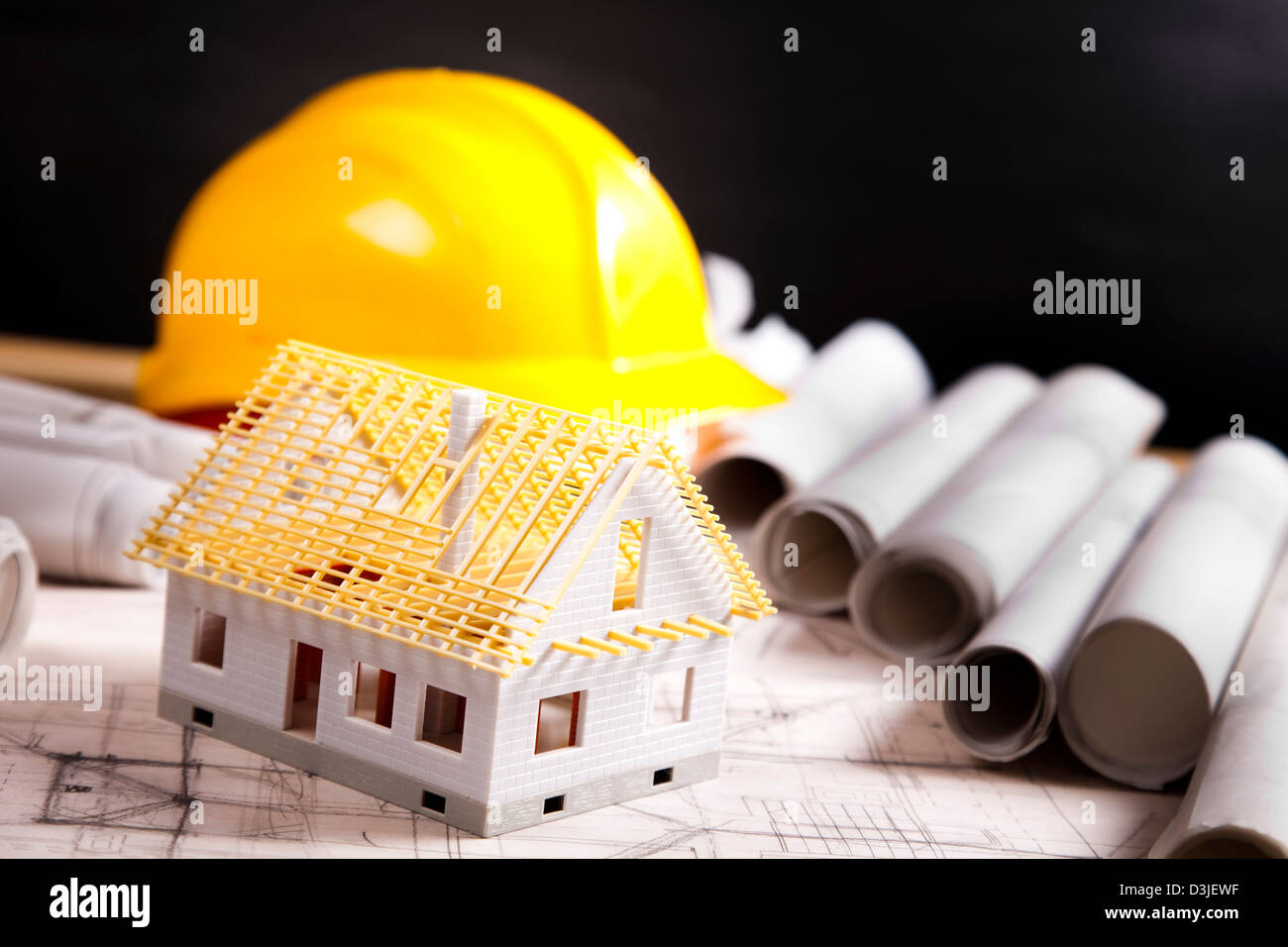 Architecture plans,house project and yellow hard hat Stock Photo - Alamy