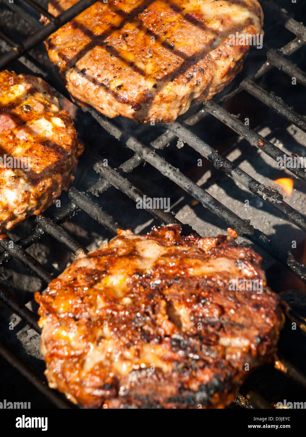 Gourmet hamburger parries on the grill Stock Photo - Alamy