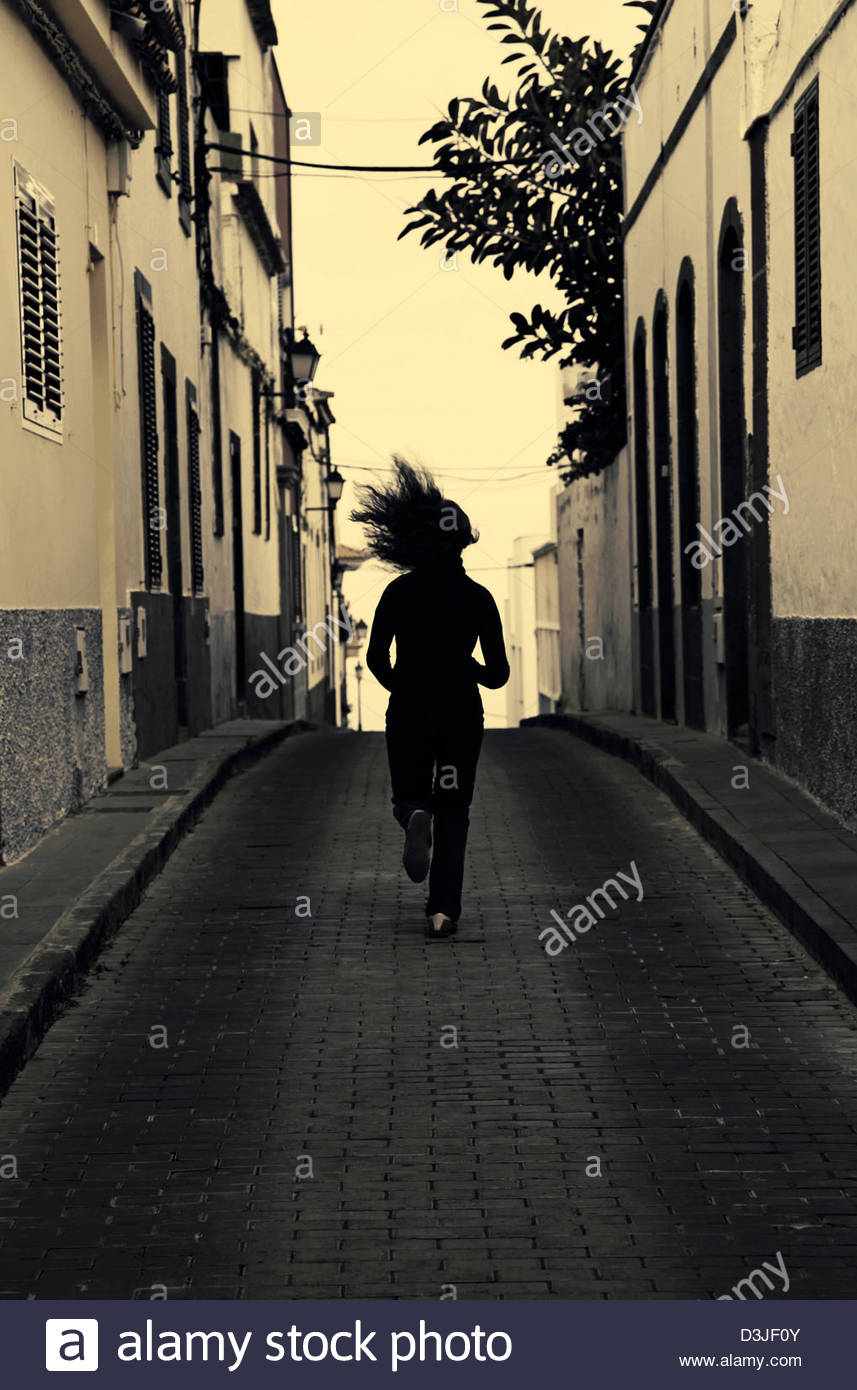 Woman Running Away Fear Stock Photos & Woman Running Away Fear Stock ...