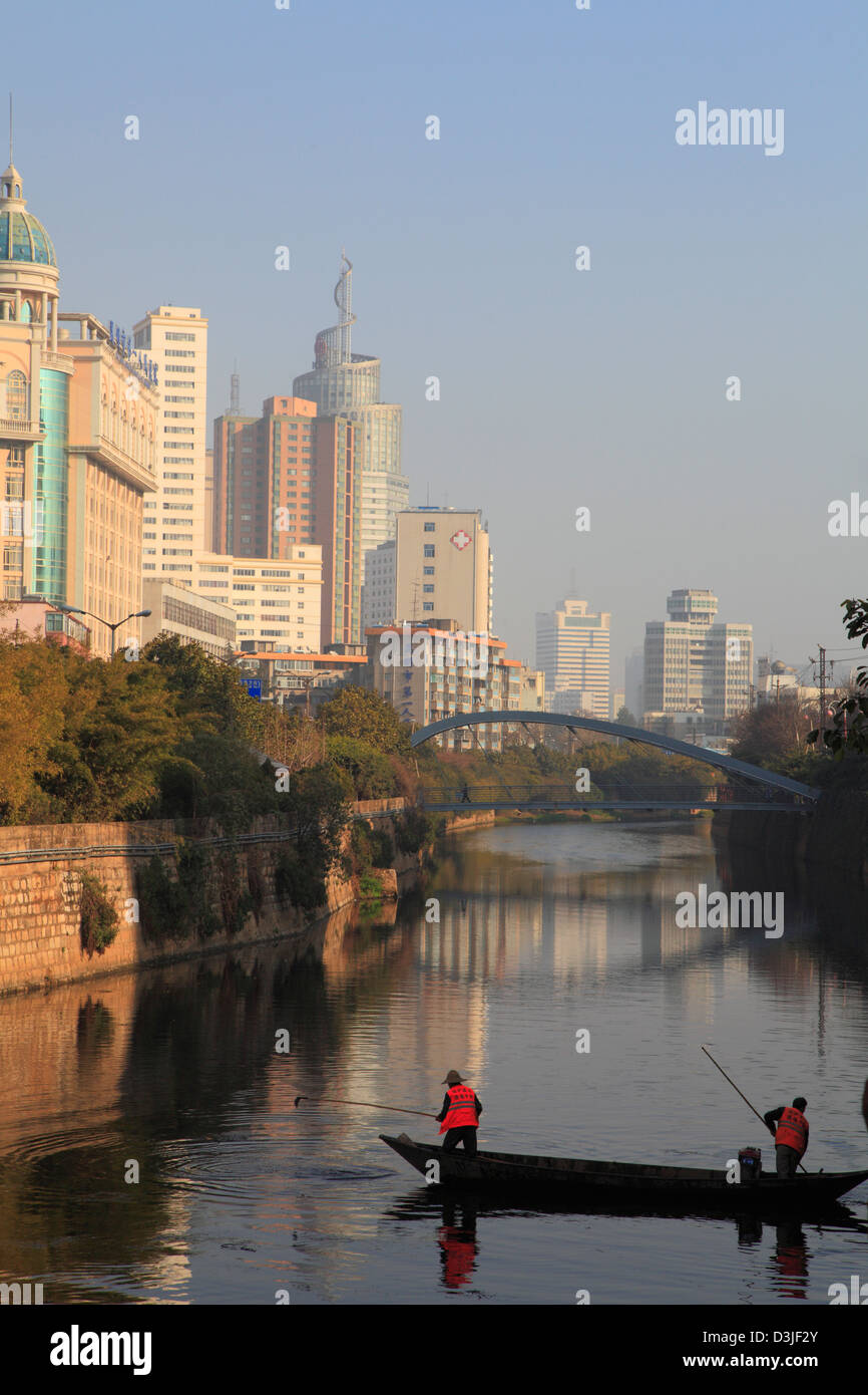 China, Yunnan, Kunming, skyline, Panlong River, boatmen Stock Photo - Alamy