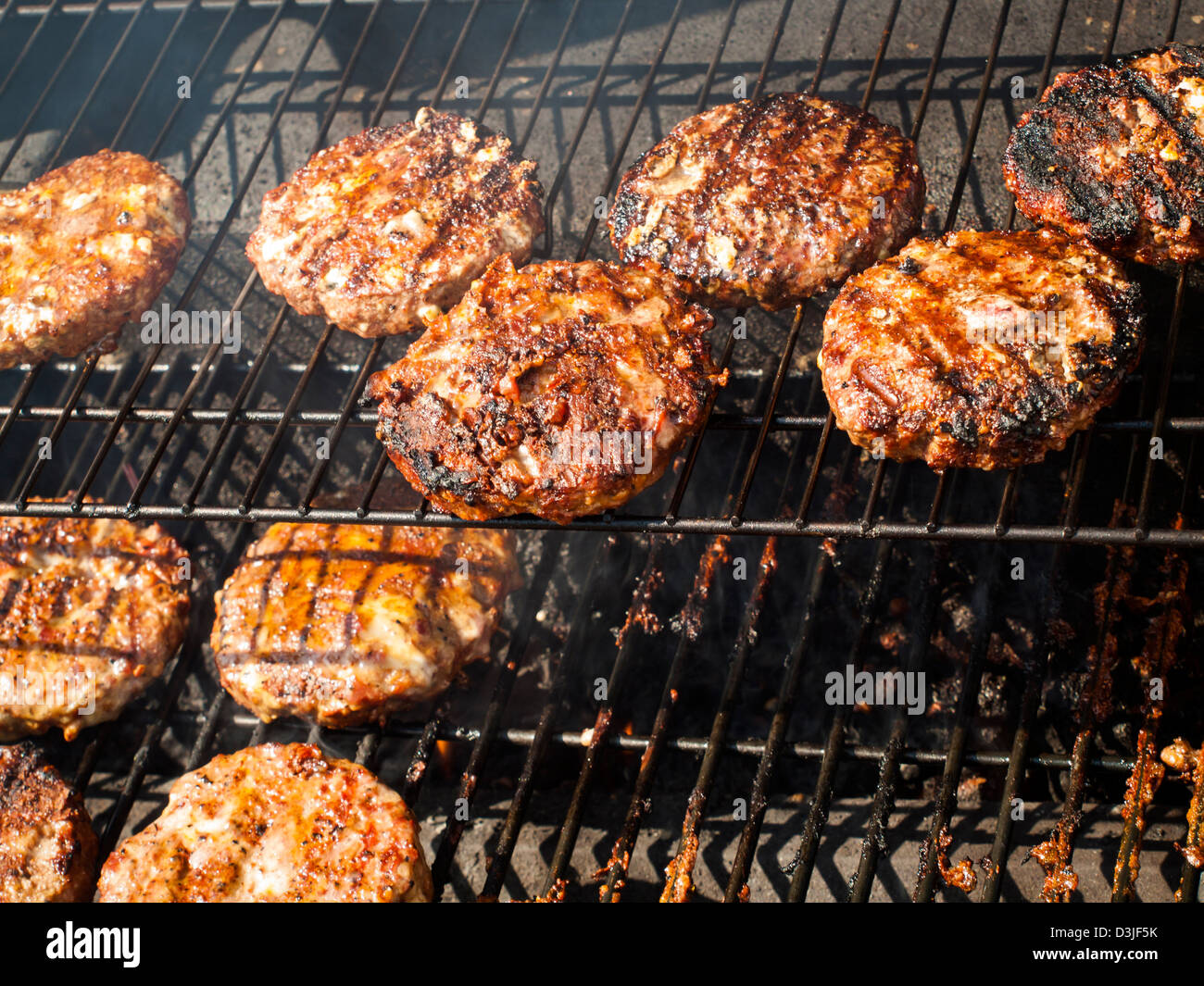Gourmet hamburger parries on the grill Stock Photo - Alamy