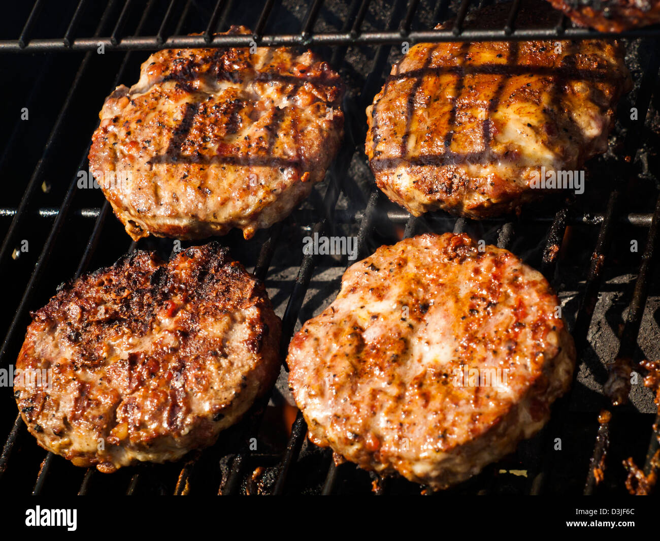Gourmet hamburger parries on the grill Stock Photo - Alamy