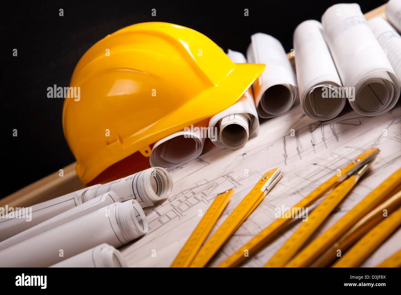 House plan blueprints with yellow hard hat Stock Photo - Alamy