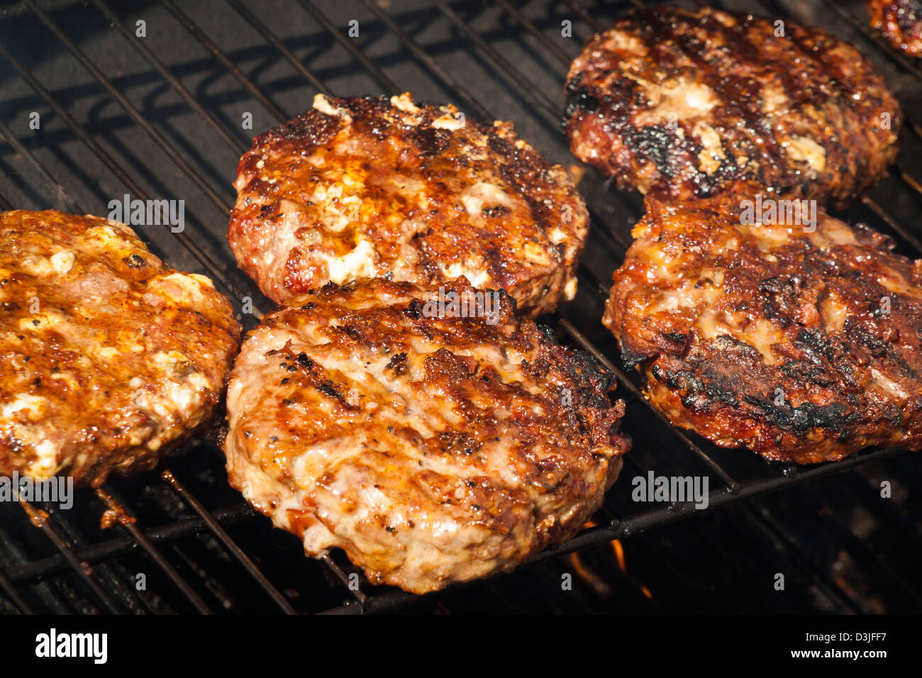 Gourmet hamburger parries on the grill Stock Photo - Alamy