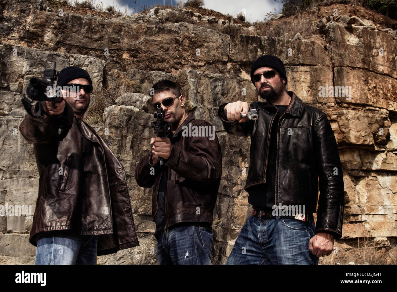 View of a group of gang members with guns Stock Photo - Alamy