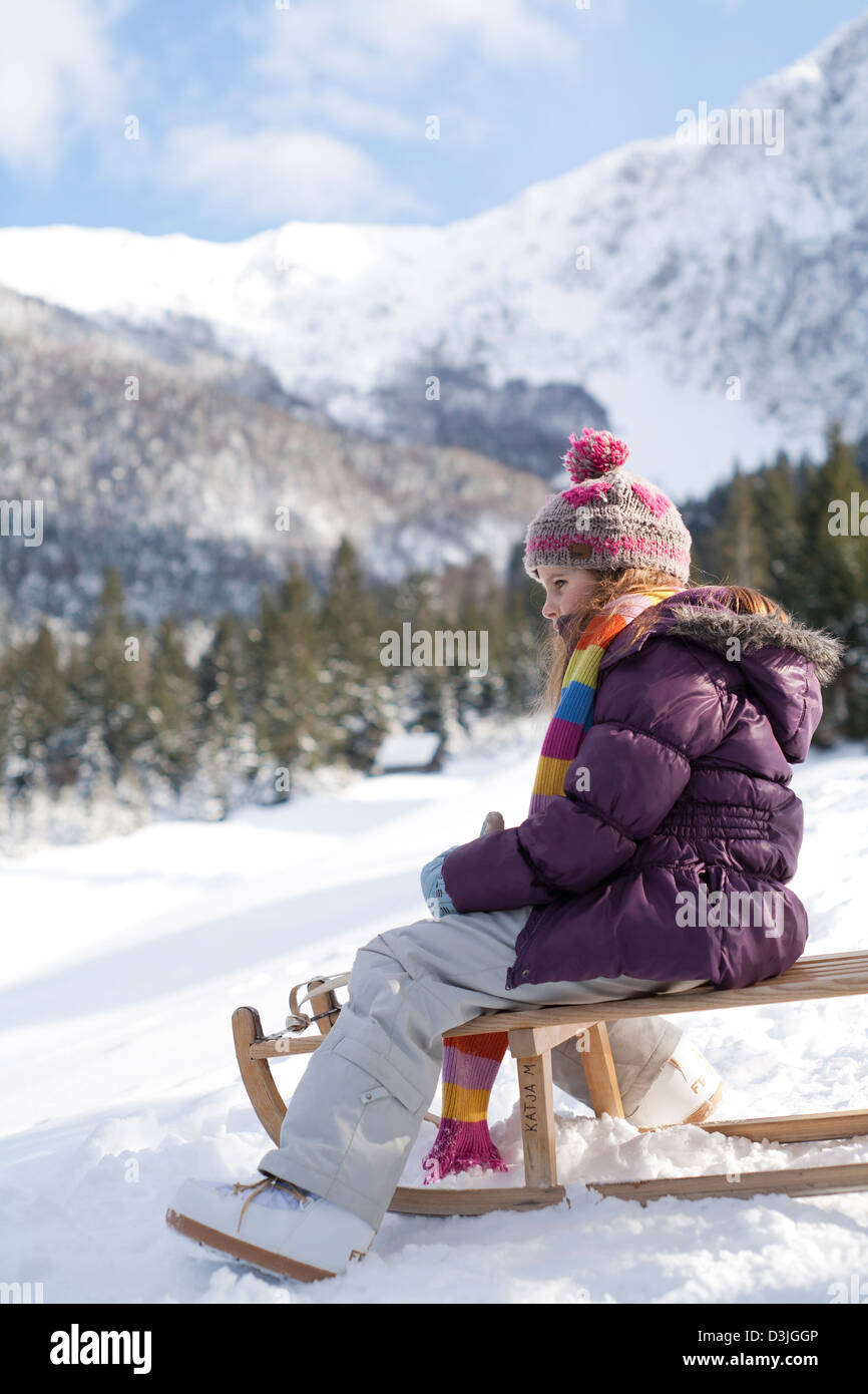 Girl with sleds Stock Photo - Alamy