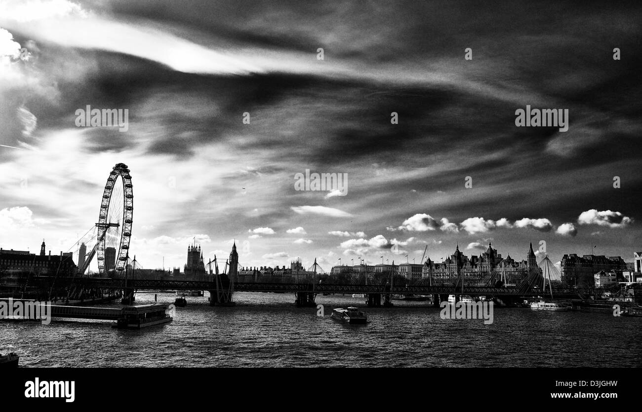 Hungerford Bridge and Golden Jubilee Bridge, London Eye in black and ...