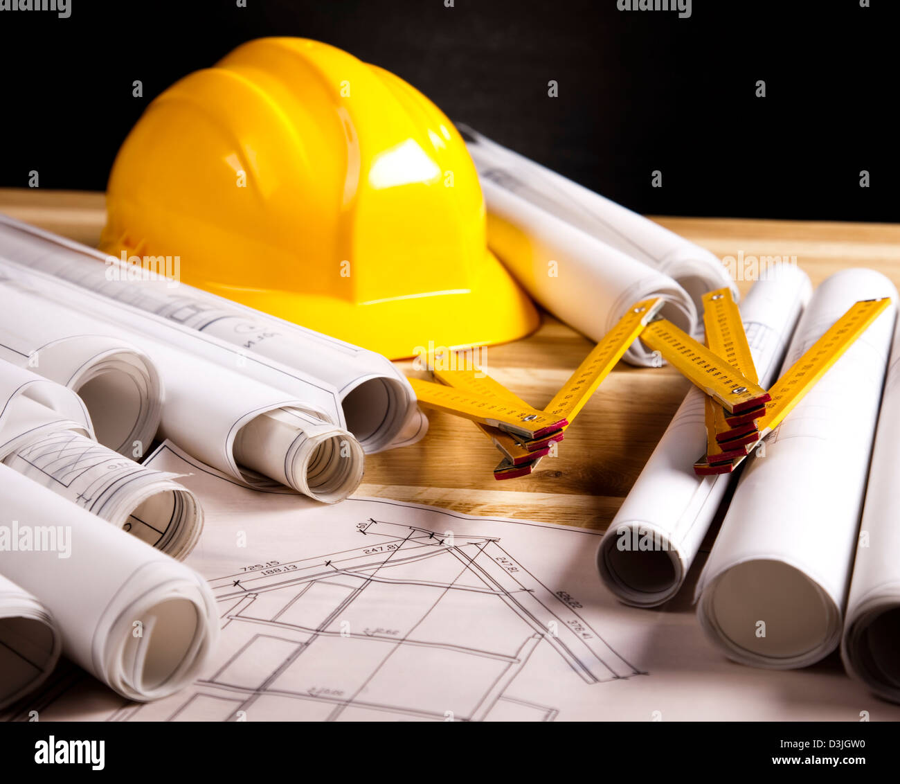 House plan blueprints with yellow hard hat Stock Photo - Alamy