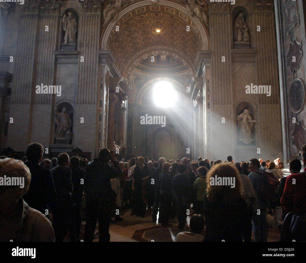 (dpa) - The sun shines through a window at Saint Peter's Basilica ...