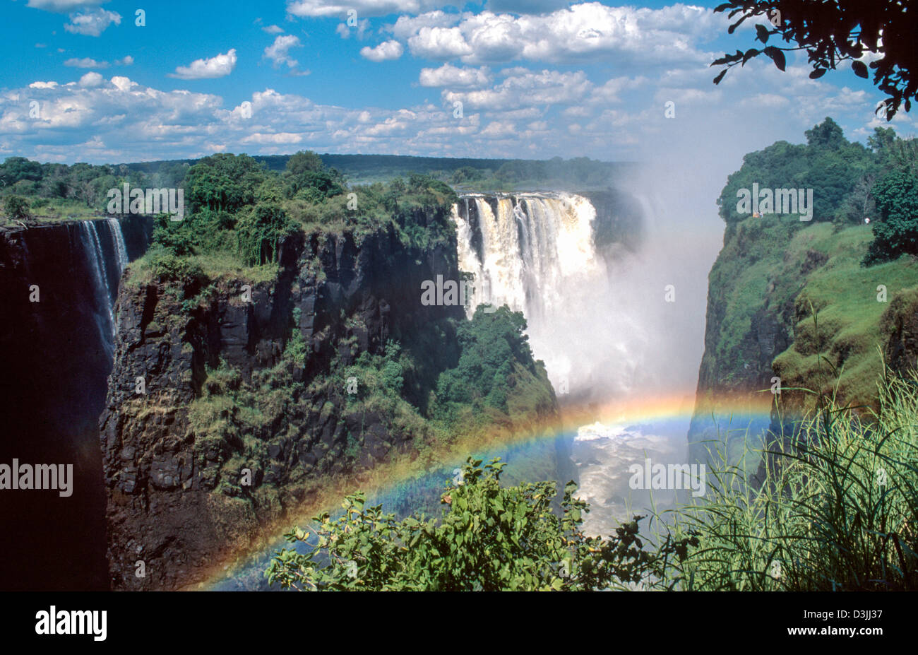Rainbow over Victoria Falls on the River Zambia. Zimbabwe Stock Photo ...