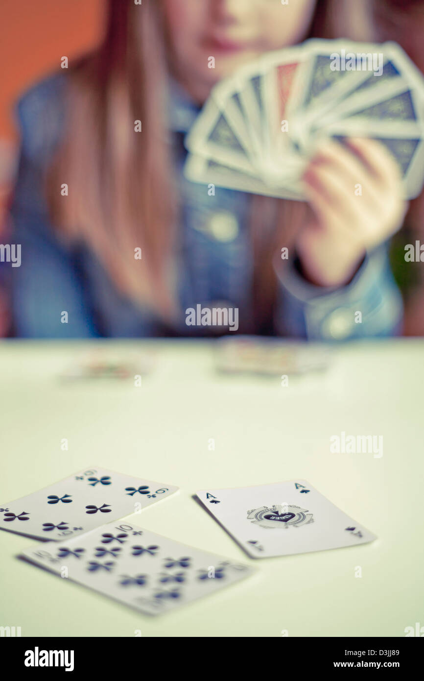 Woman playing cards Stock Photo - Alamy