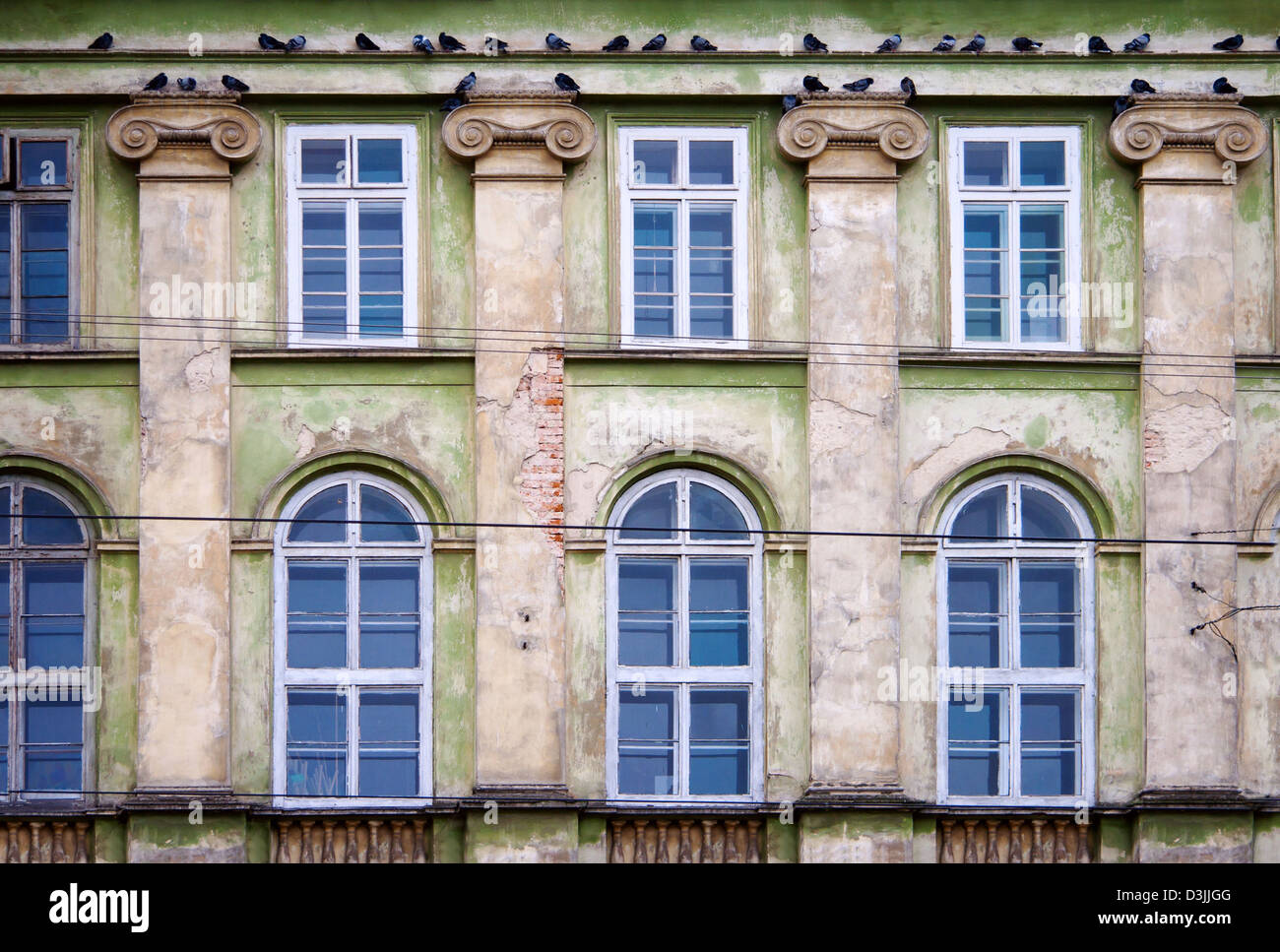 dirty wall with windows Stock Photo - Alamy