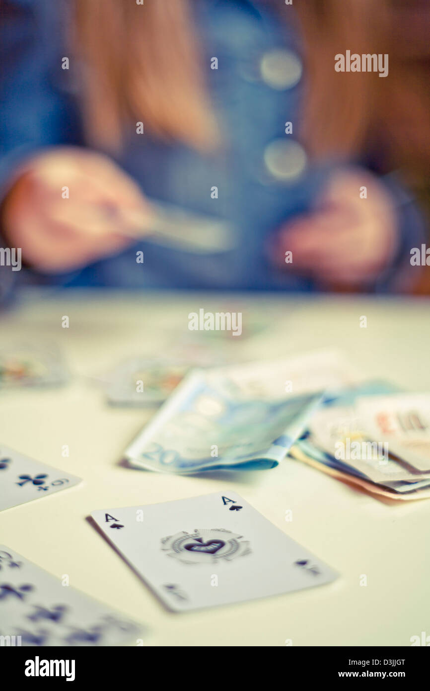 Woman playing cards Stock Photo - Alamy