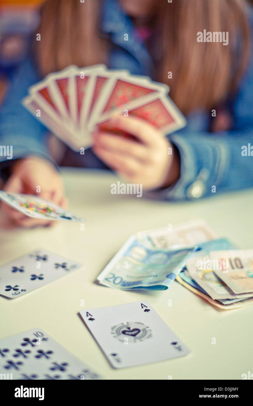 Woman playing cards Stock Photo - Alamy