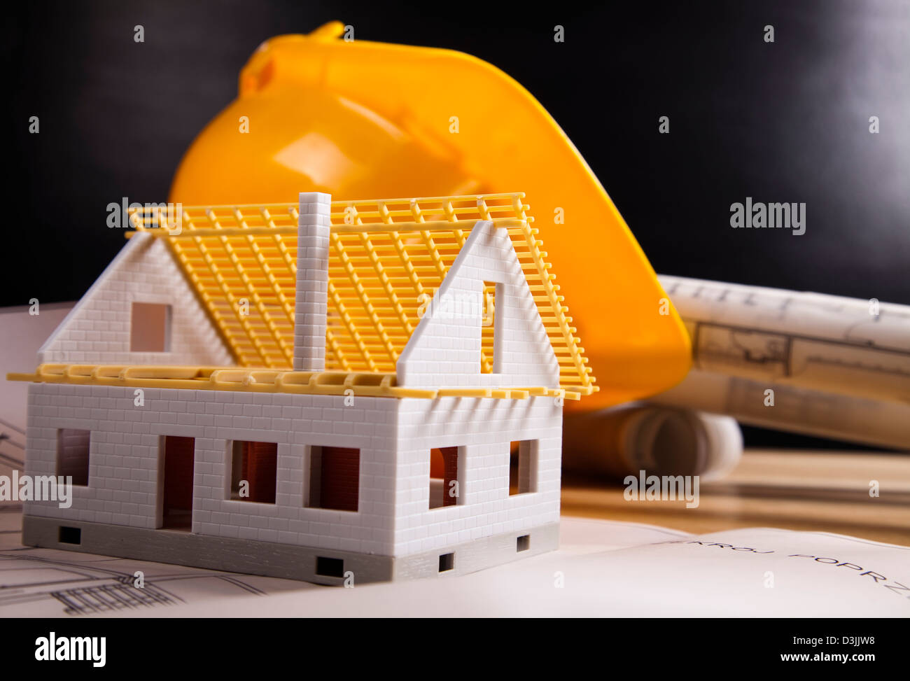 Architectural plans and yellow hard hat Stock Photo - Alamy