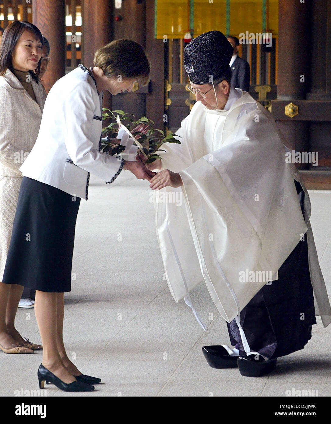 Yoshinari Mori, deputy high priest of the Meiji-Shrine, hands a holy ...