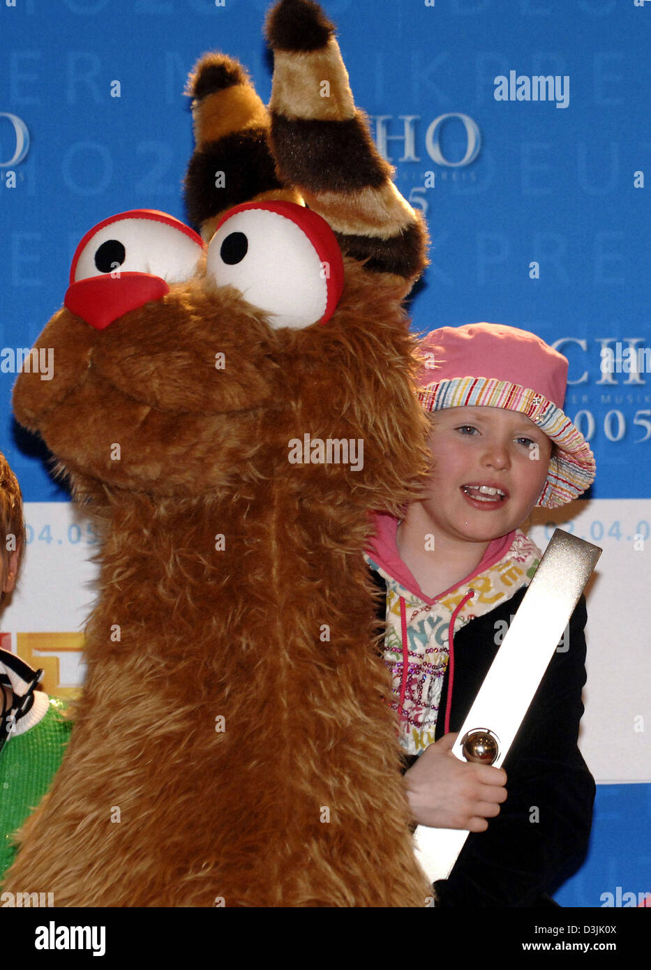 (dpa) - Newcomer singer Joy sits on the back of cuddly giant camel and ...