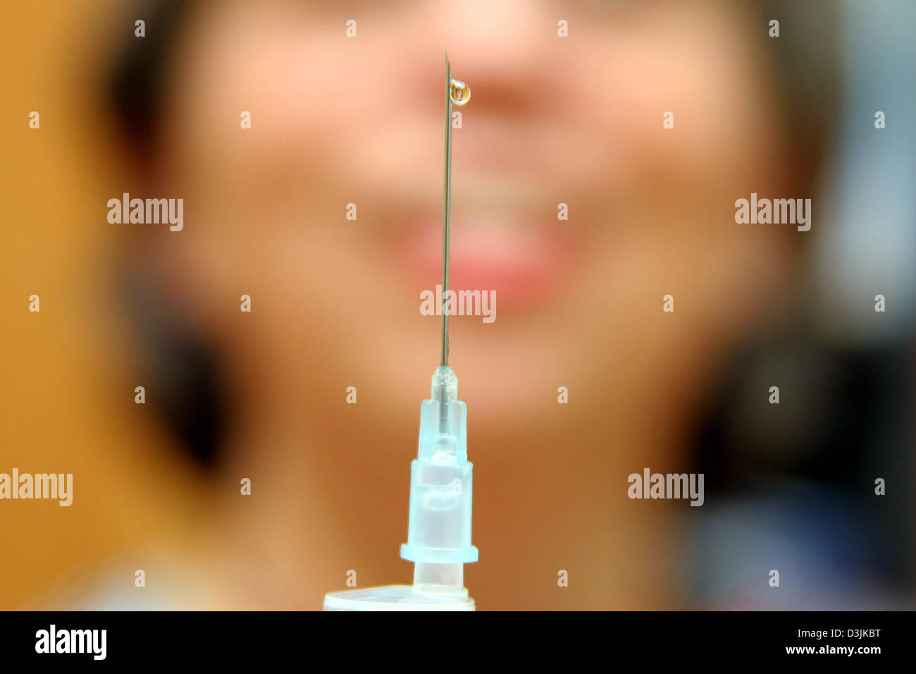 (dpa) - Drops of liquid spill out of a syringe pictured in Frankfurt ...