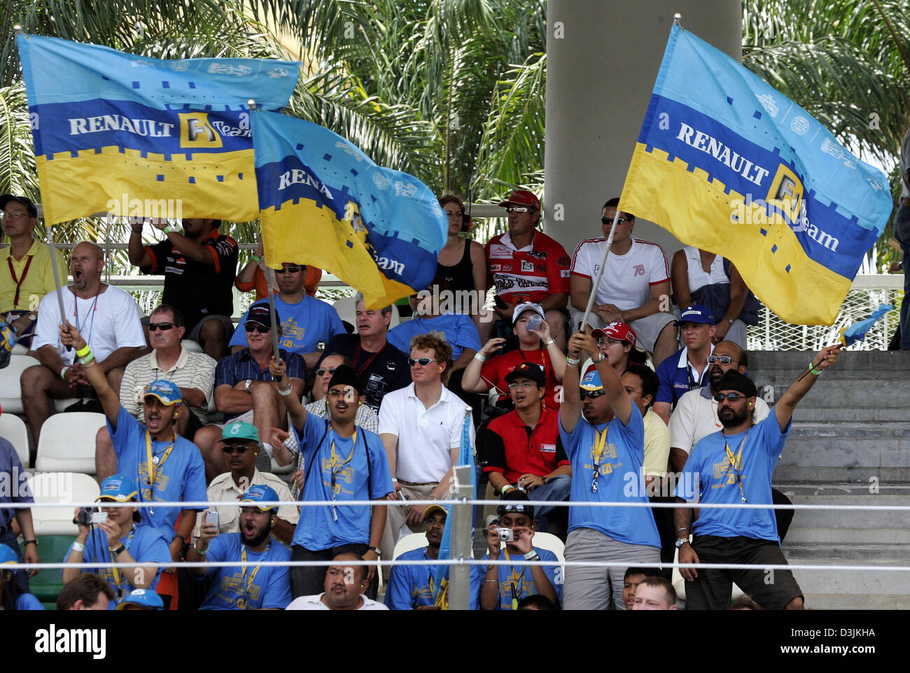 (dpa) - Fans of the Renault Formula One team wave their flags during ...