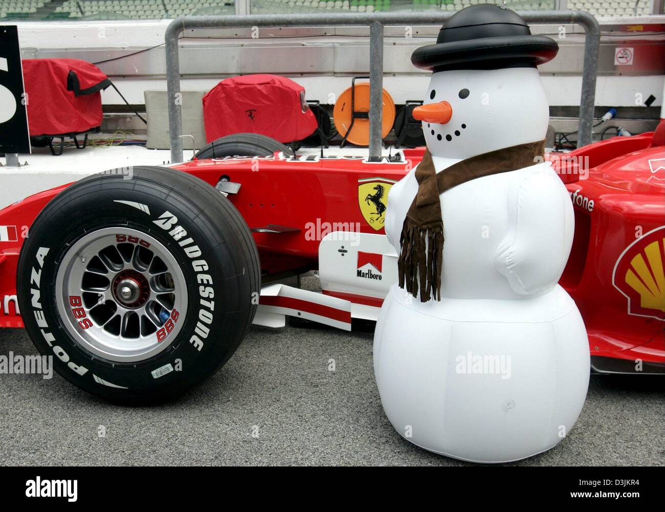 (dpa) - A plastic snowman stands next to the racing car of German ...